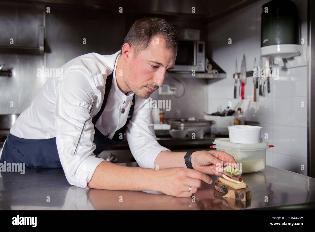 Woman adding salt to food hi-res stock photography and images - Alamy