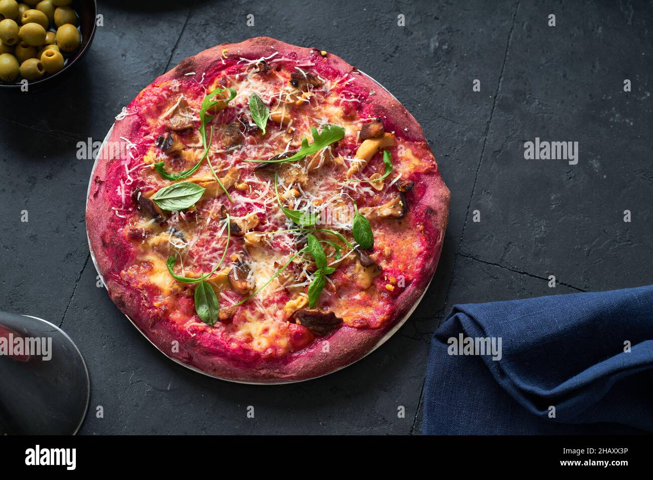 Purple colored rustic pizza with beetroot and vegetarian topping. Top ...