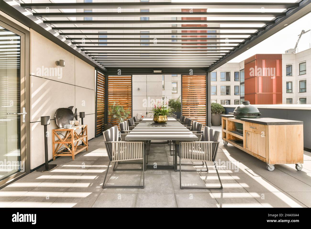 Exterior of spacious modern terrace with dining table with chairs ...