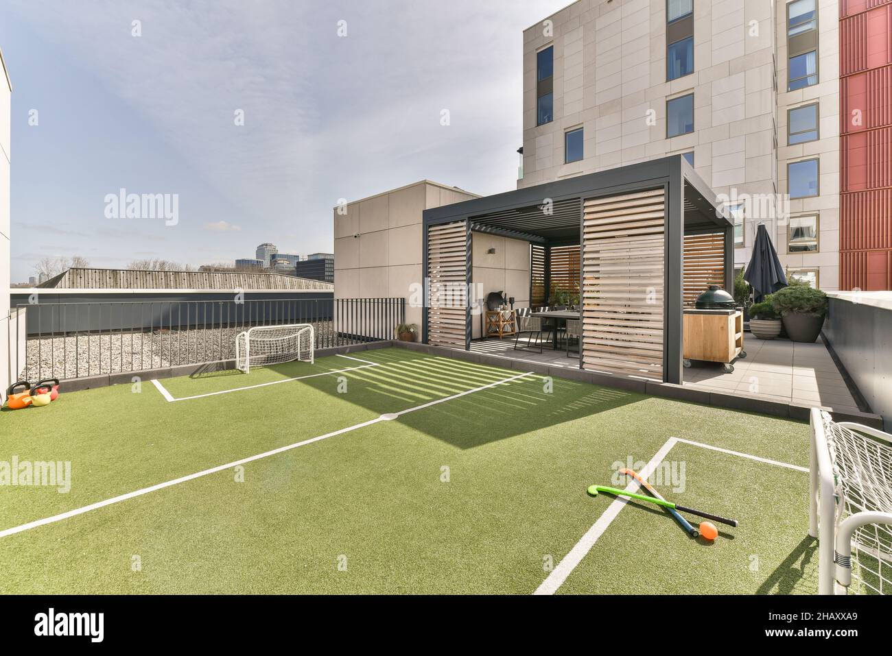 Modern terrace exterior with dining covered area with grill and ...