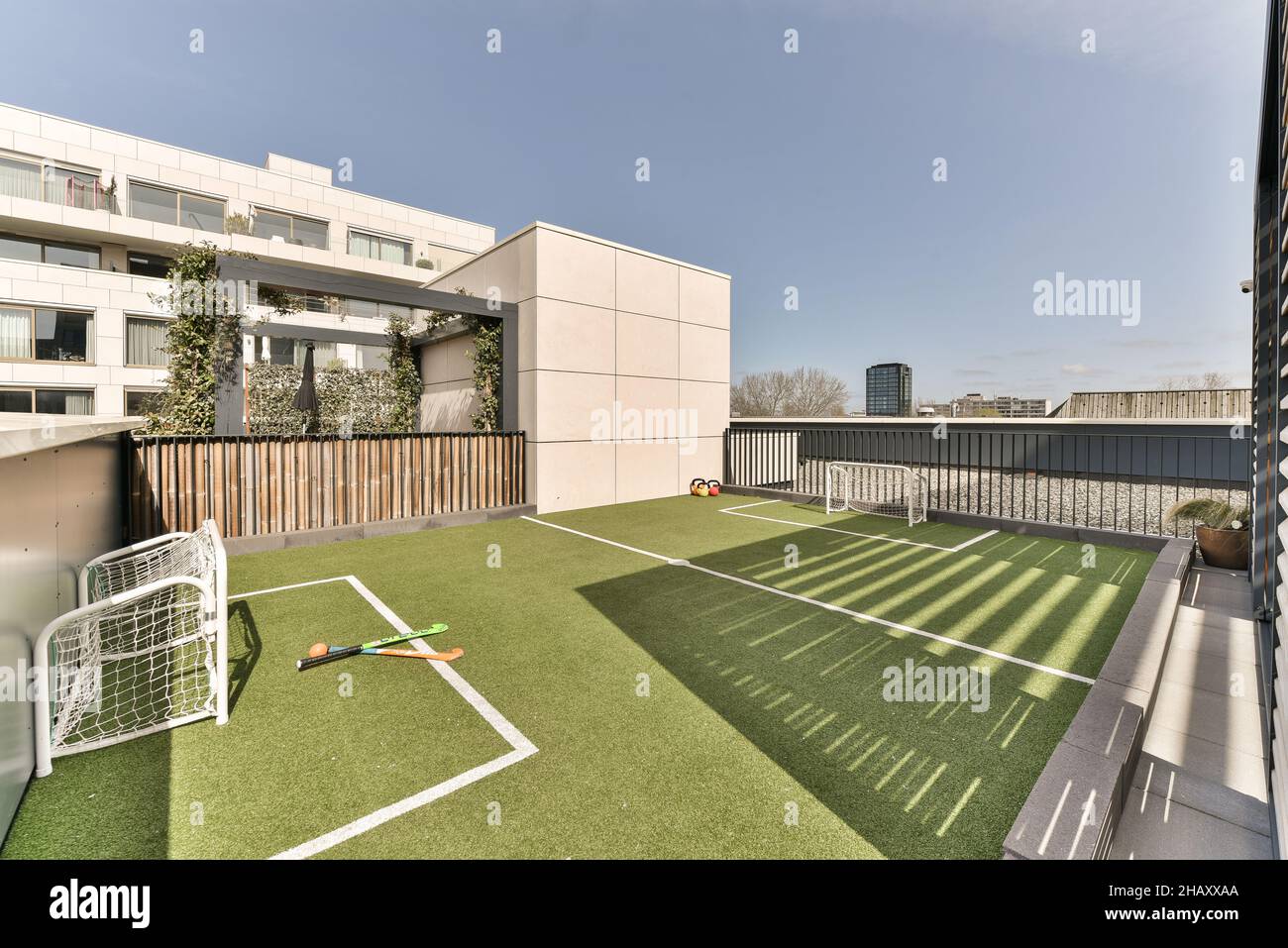 Residential house with open air playground with field hockey goal and ...