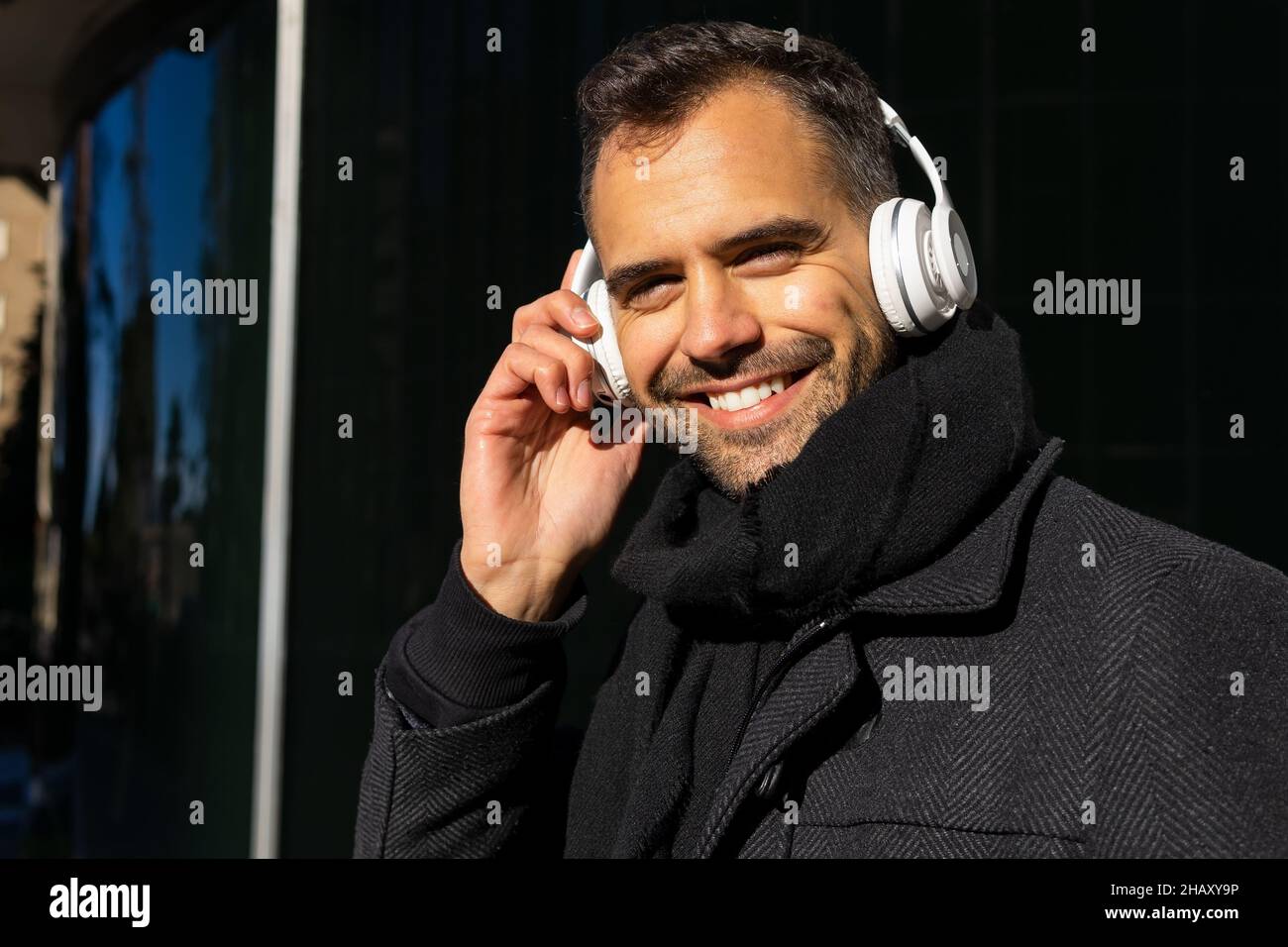 Adult female patient sitting on bed in hospital ward near medicine ...