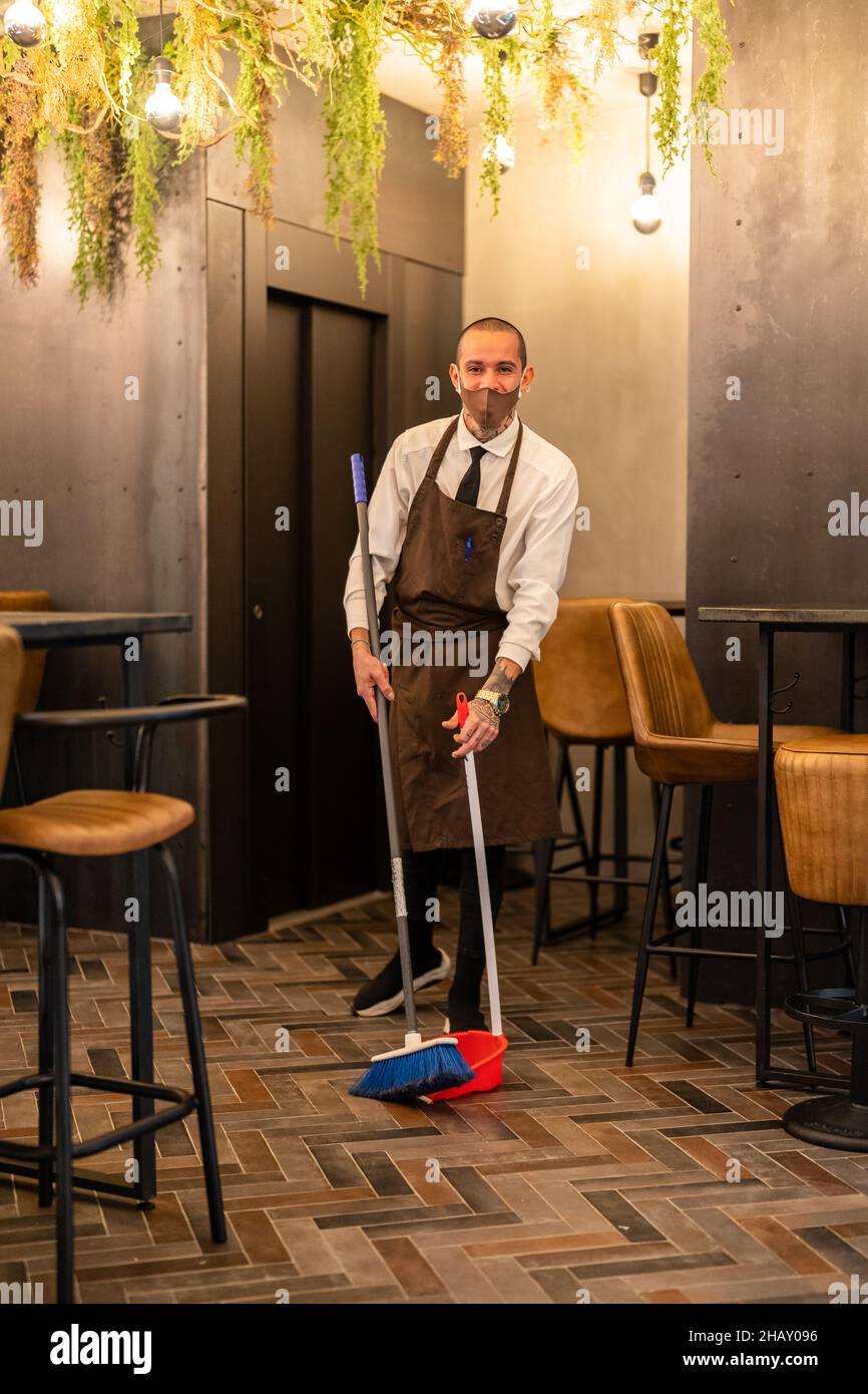 Back view faceless sporty female in trendy wear riding cruiser board ...