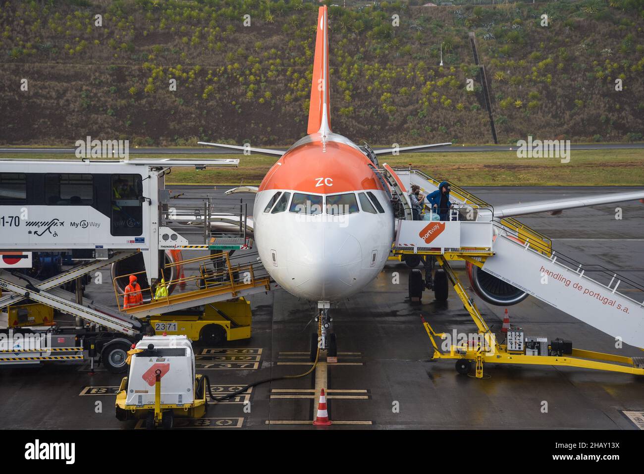 Passengers boarding Airbus A320 easyJet plane in Funchal airport Stock ...