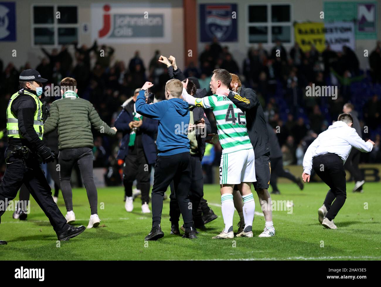 Celtic's Callum McGregor takes a selfie with pitch invaders during the ...