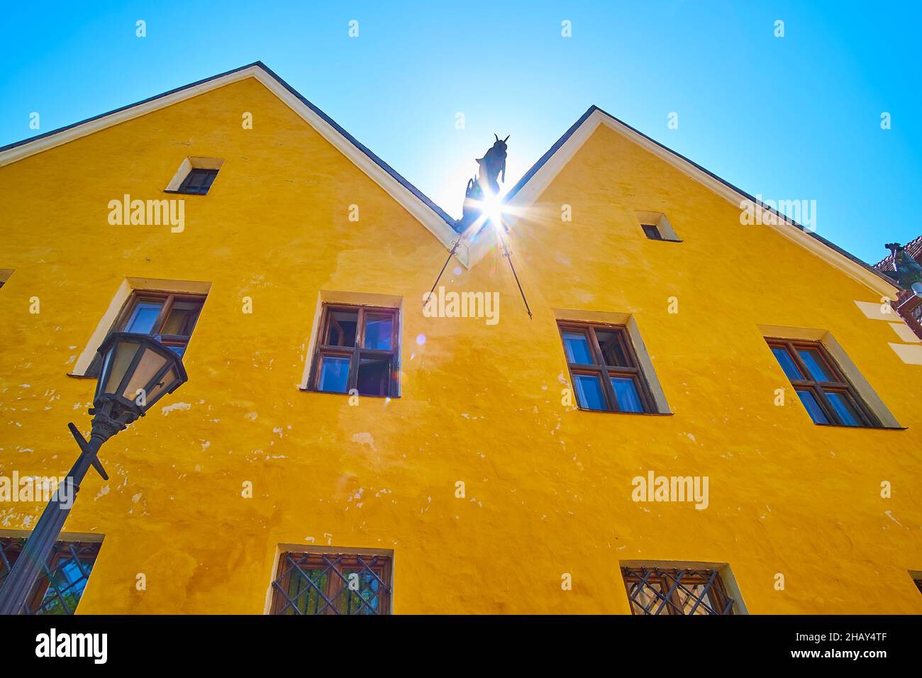 The bright sun rays light through the dragon-shaped gargoyle, located ...