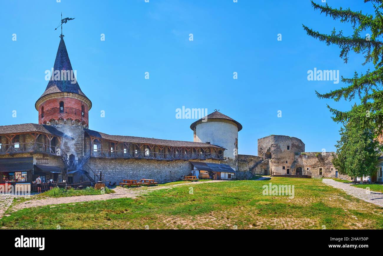 Panorama of the castle court with tall towers, wooden gallery on the ...