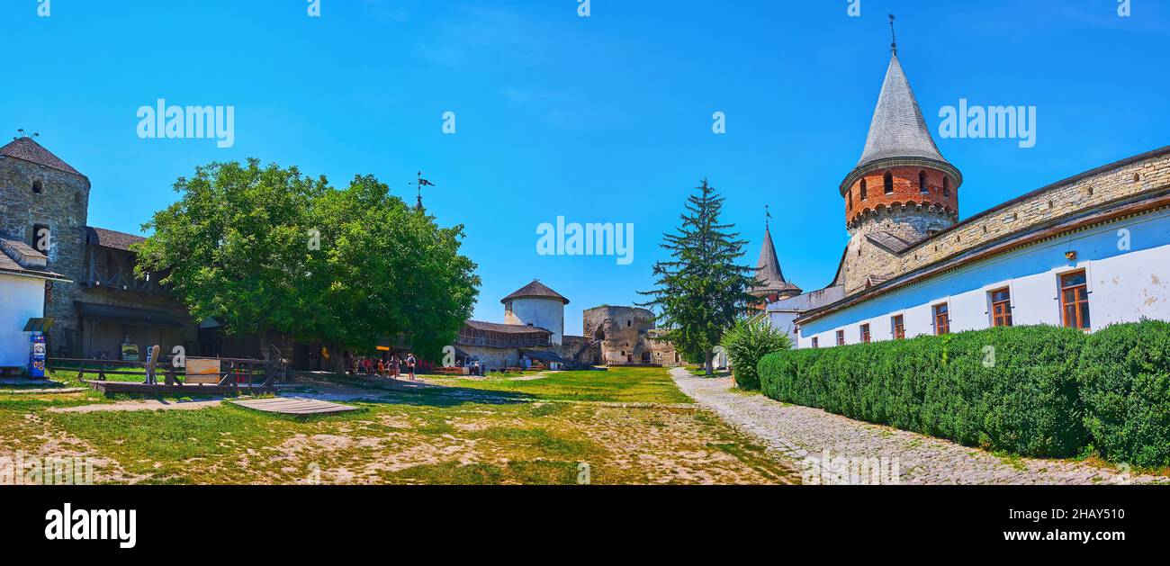 Panorama of the courtyard with medieval parade grounds, tall towers and ...