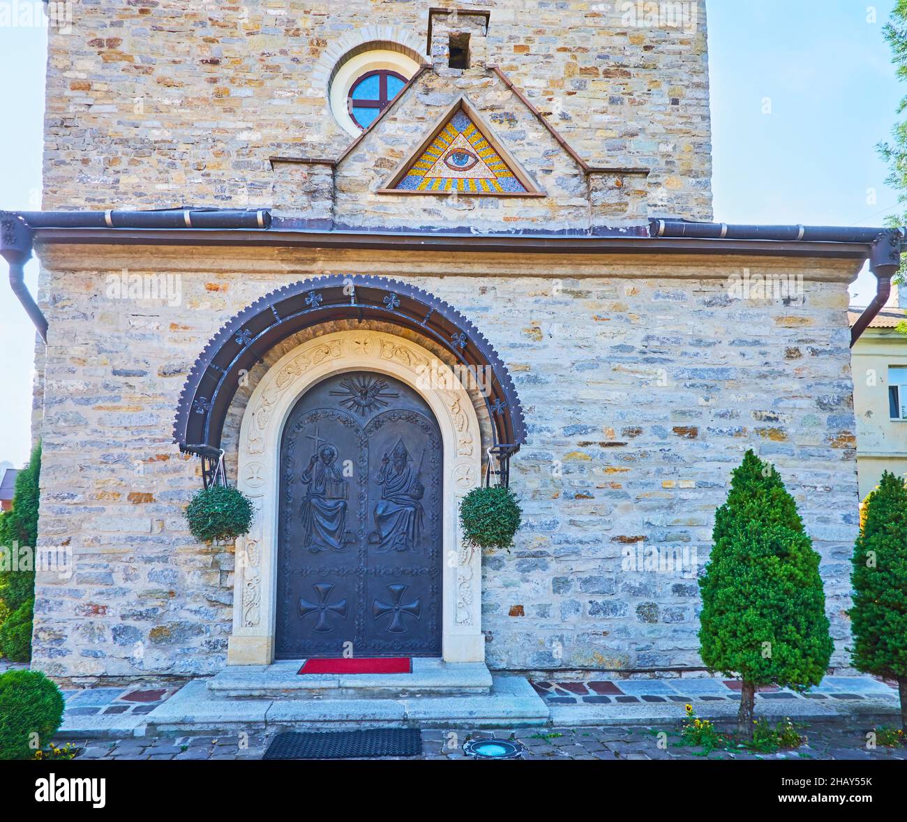 The beautiful arched main door of Holy Trinity Church, decorated with ...