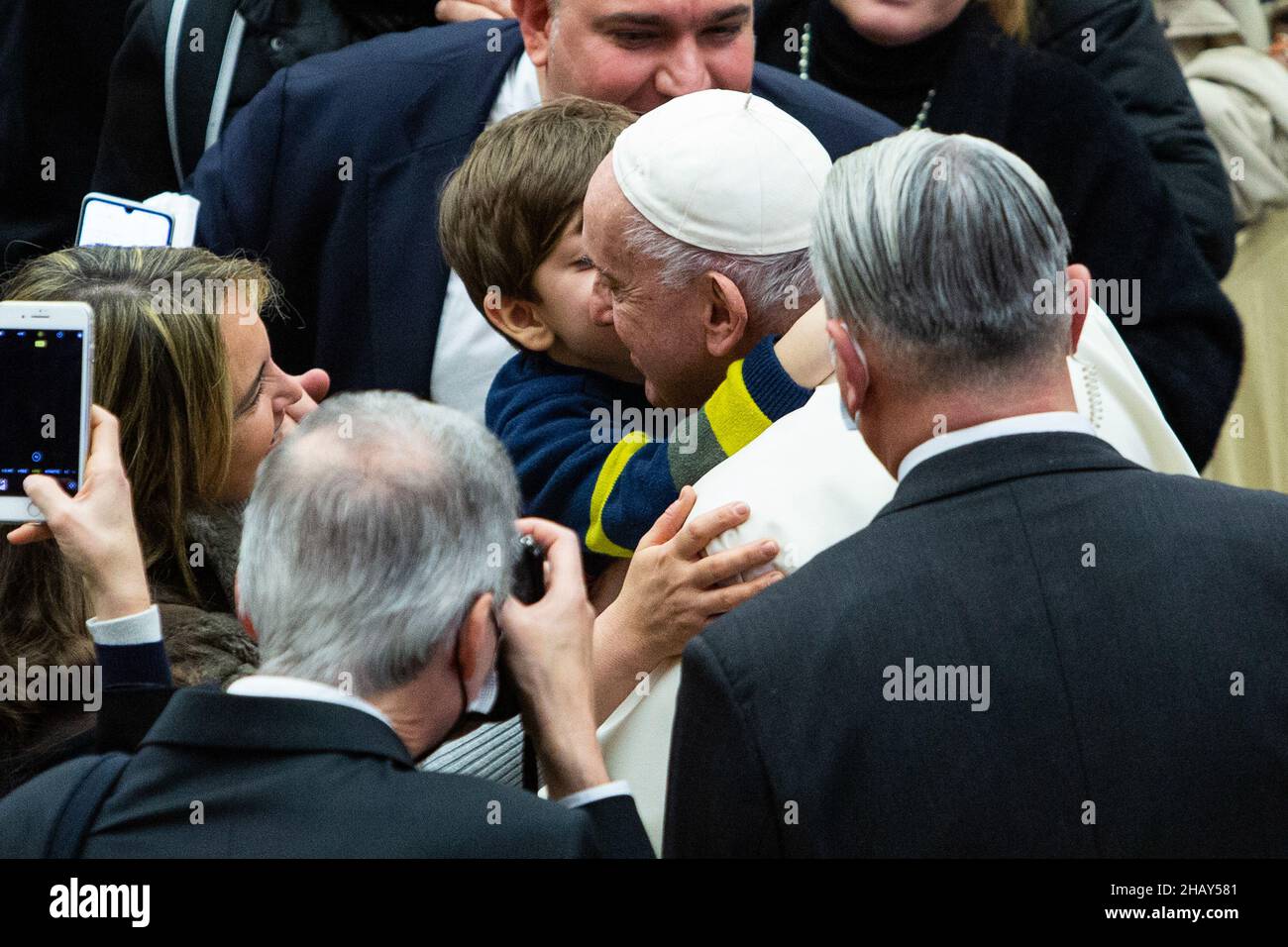 Vatican City, Vatican. 15th Dec, 2021. Pope Francis hugs faithful kid ...