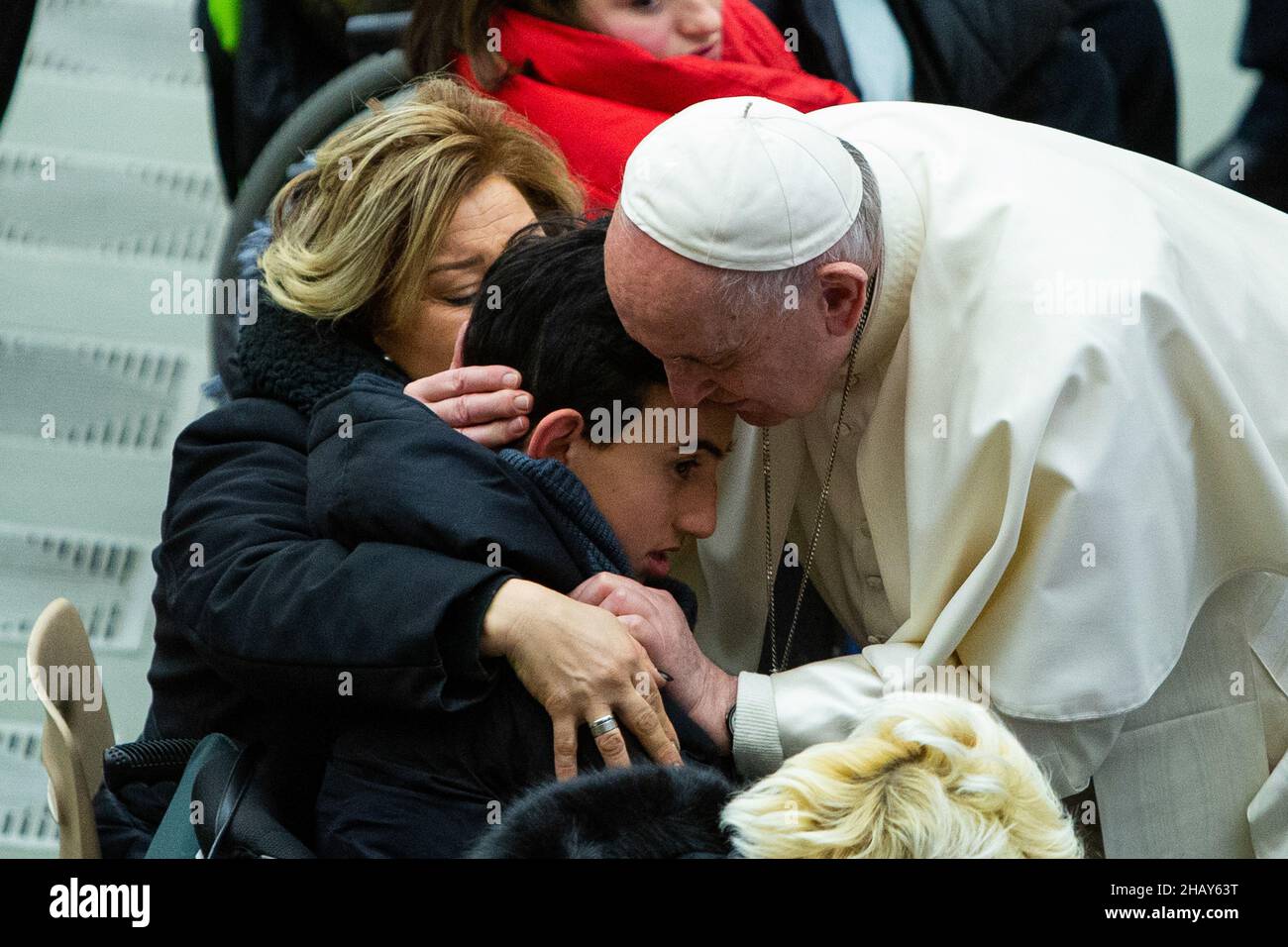 Pope Francis hugs faithful boy during the general audience. Traditional ...