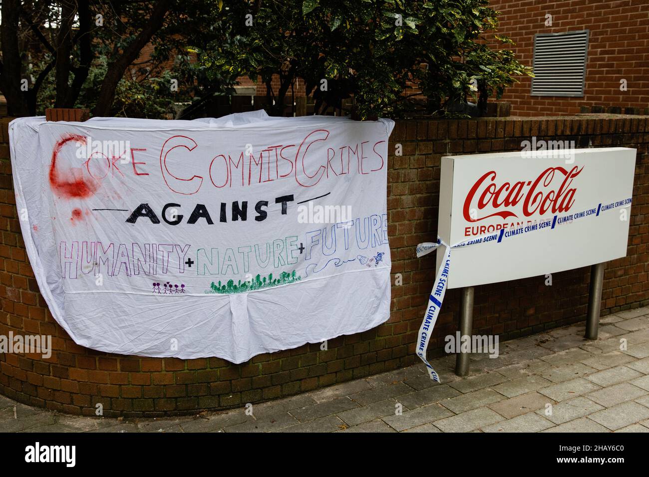 London, UK. 15th December, 2021. A banner is pictured alongside a Coca ...