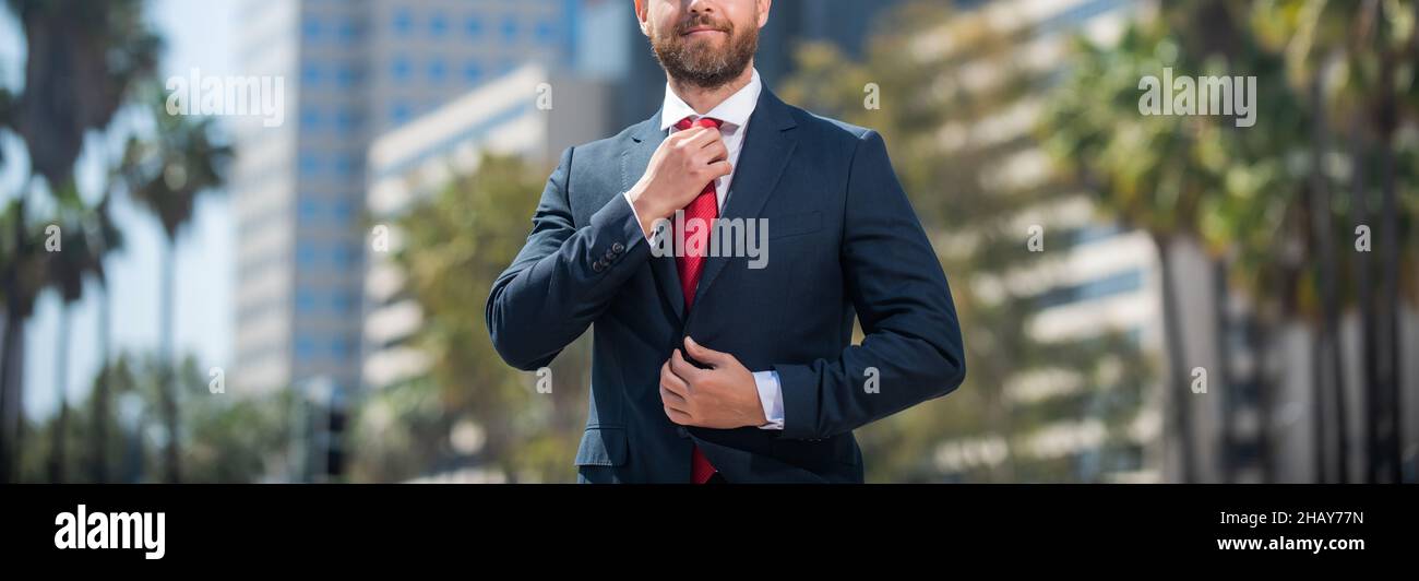 successful man in businesslike suit. manager executive outside the ...