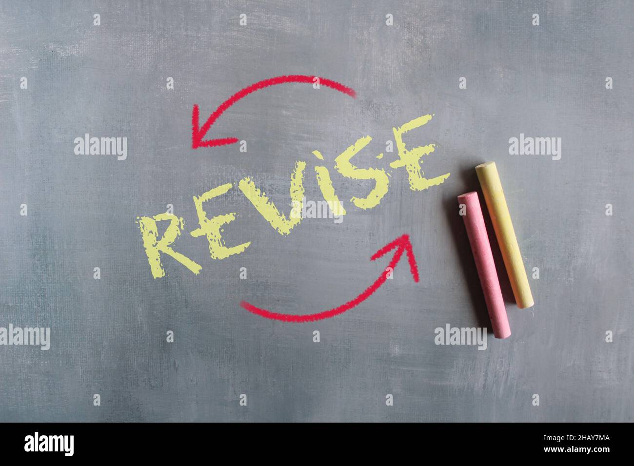 Chalkboard drawing image of arrow and text REVISE Stock Photo - Alamy