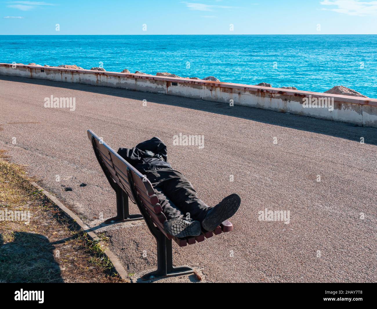 Poor man on bench at beach hi-res stock photography and images - Alamy