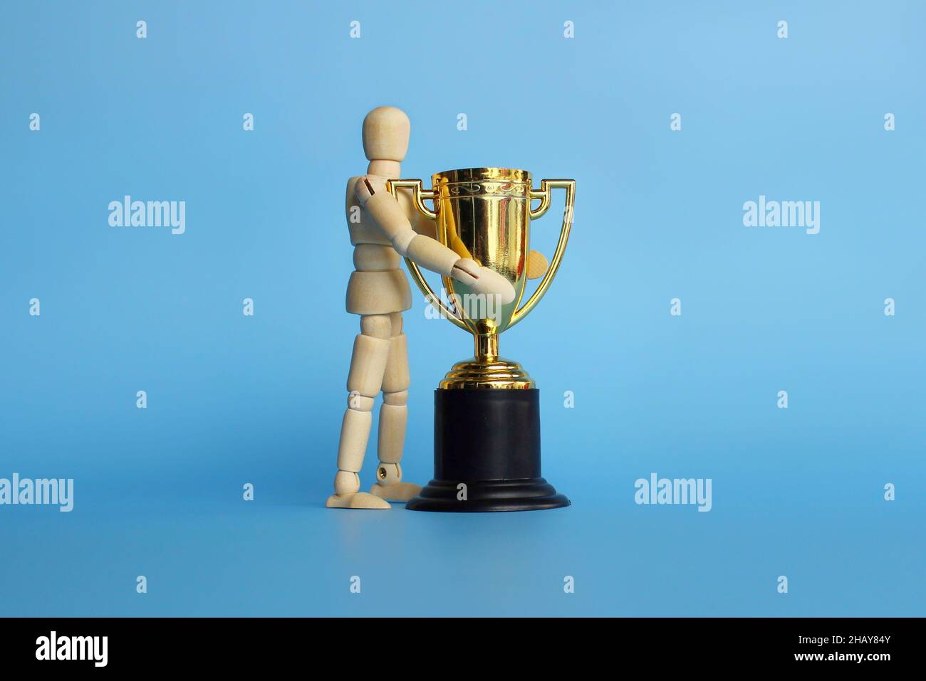 Celebration, victory and winning concept. Miniature wooden figure hug ...