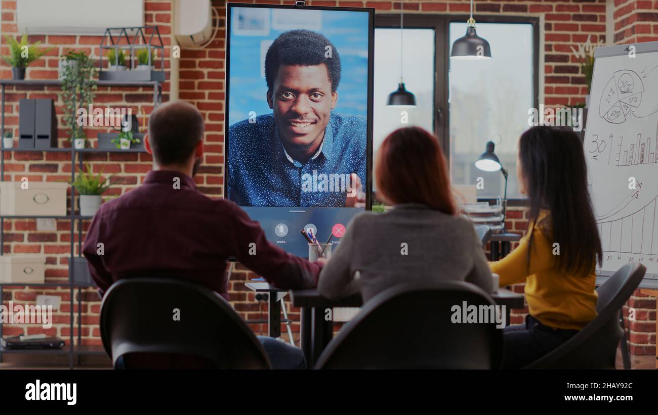 Group workmates attending video call hi-res stock photography and ...