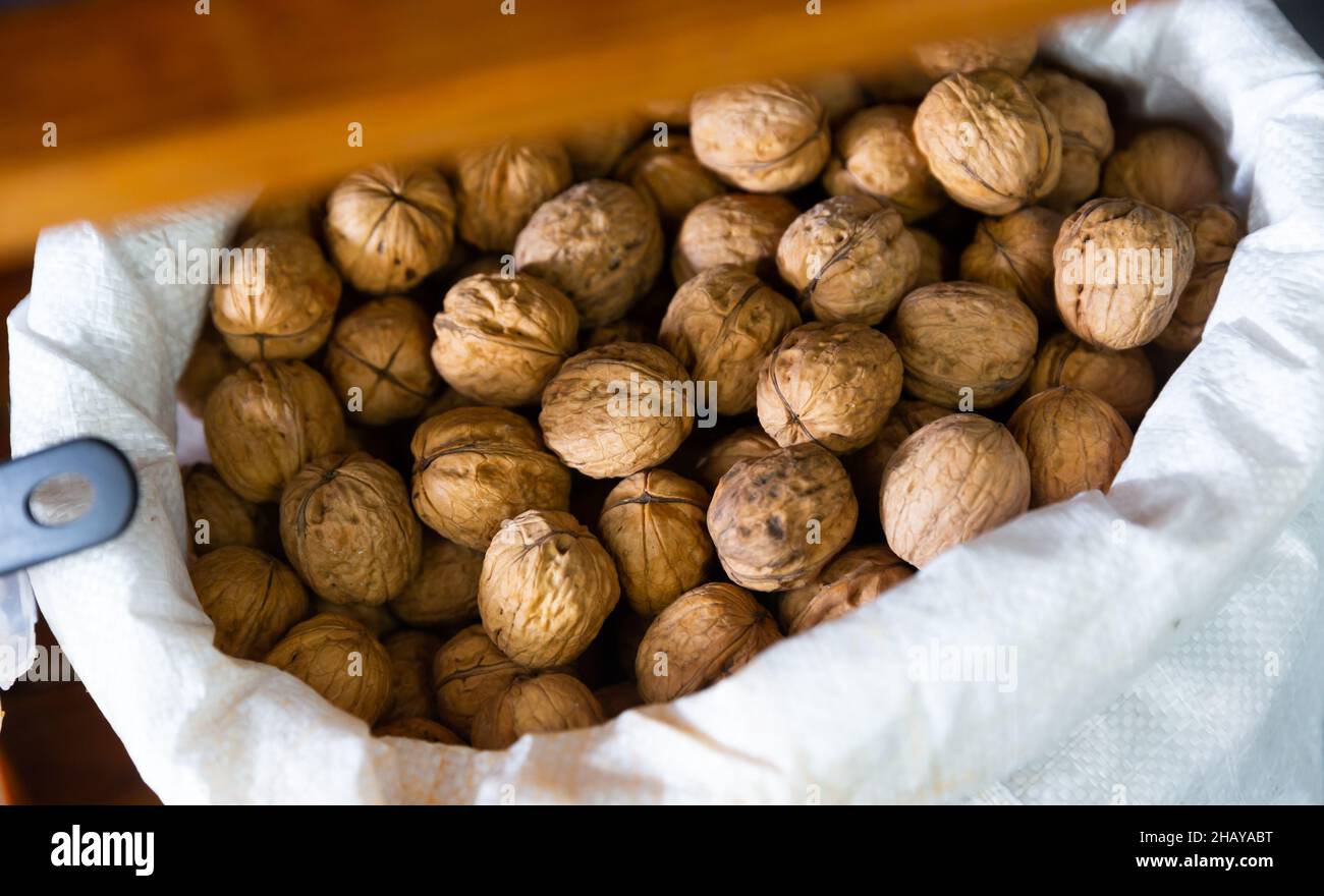 Whole walnuts in box at farmers market Stock Photo - Alamy