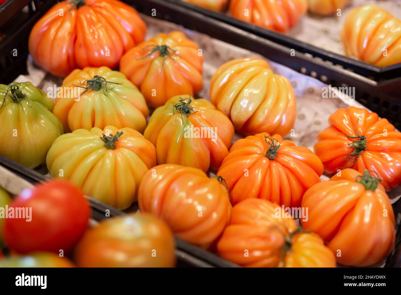 Boxes with tomatoes in store Stock Photo - Alamy