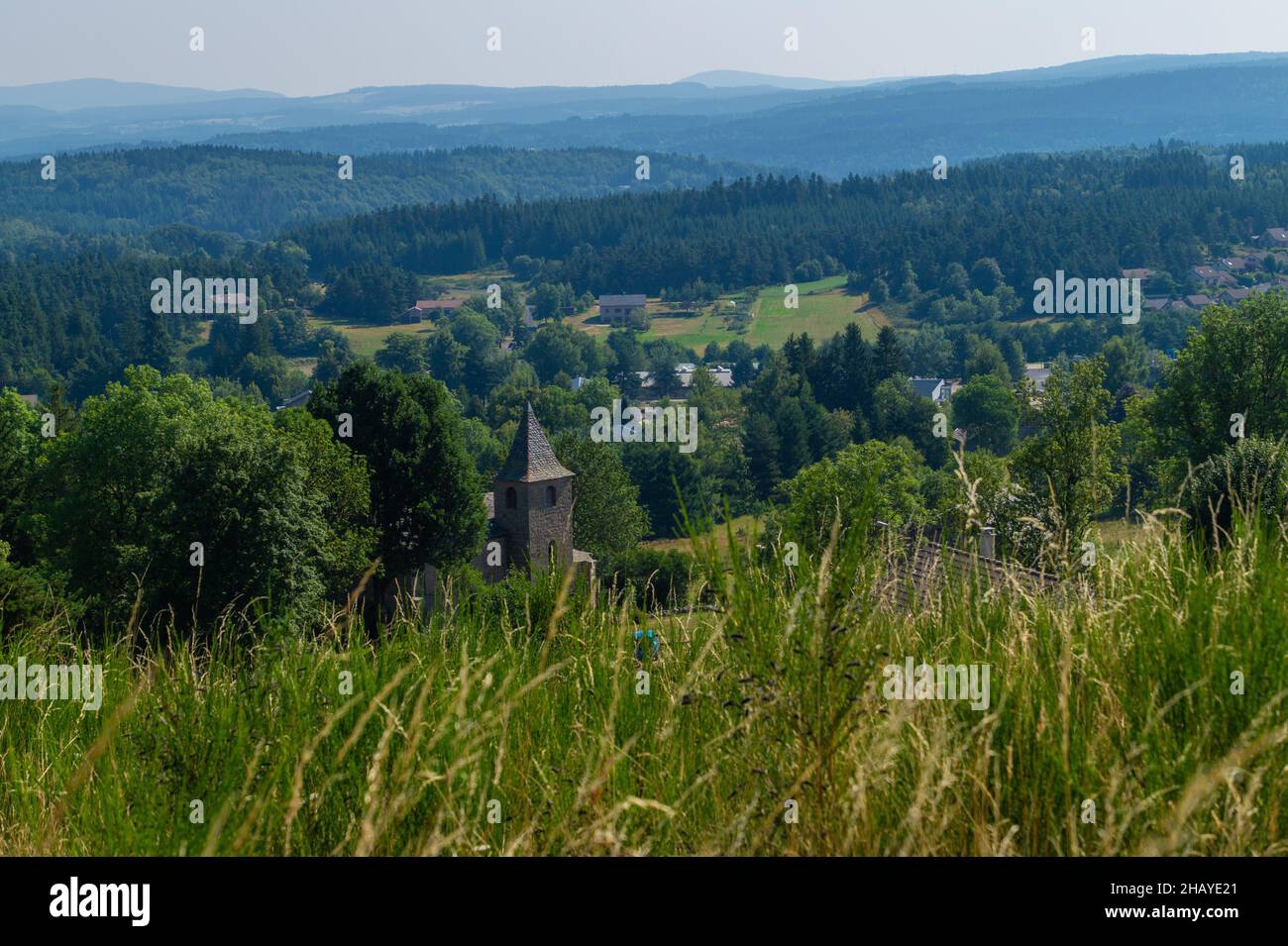 Beautiful view of Saint Voy church on the green mountain in France ...