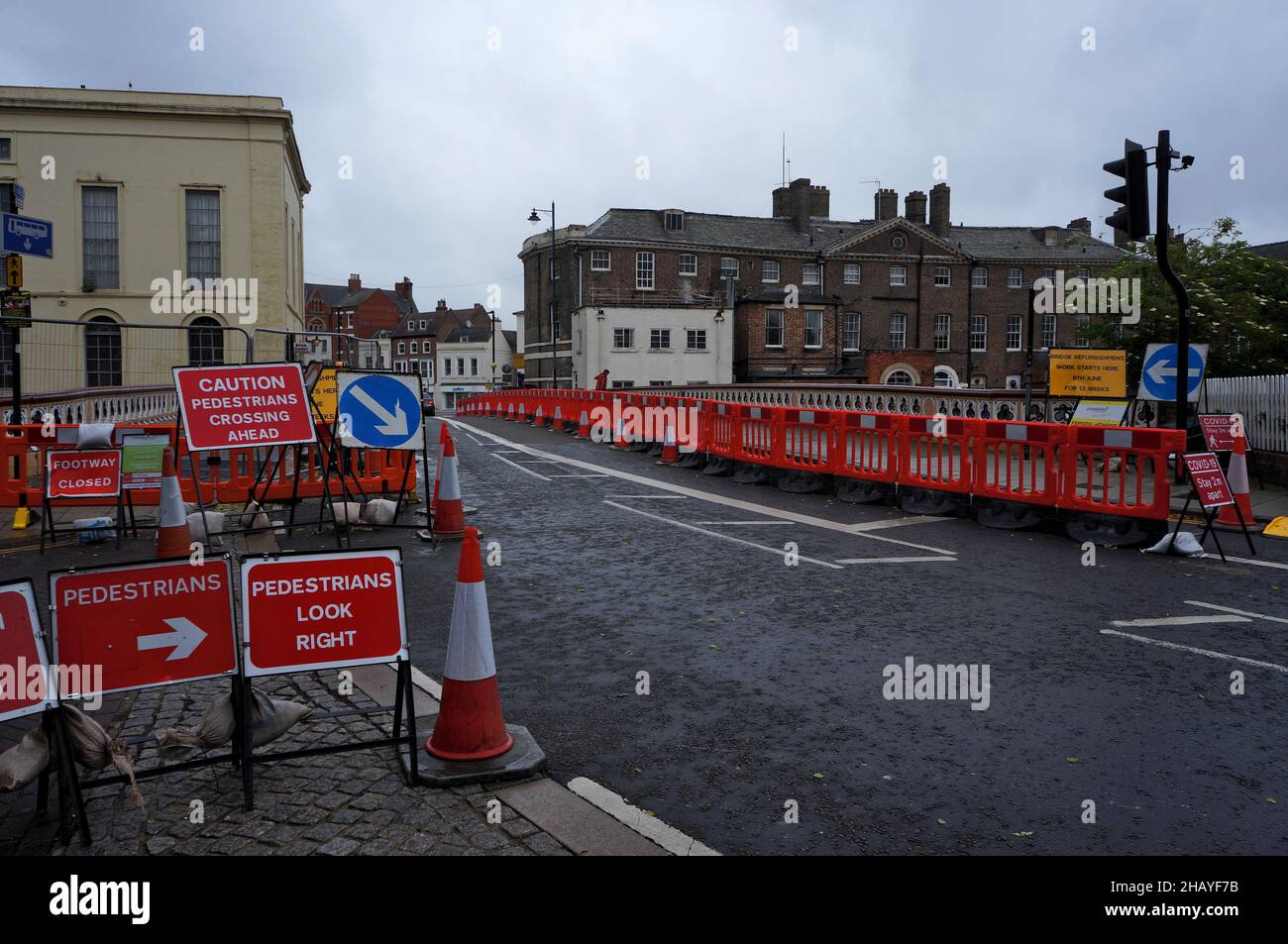 repair work on the town bridge in Boston with red warning signs ...