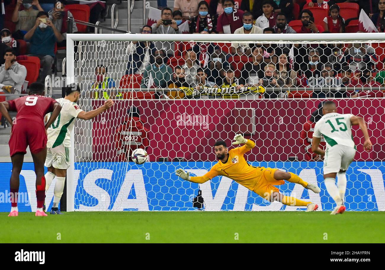Doha, Qatar. 15th Dec, 2021. Qatar's goalkeeper Saad Al Sheeb (2nd R ...