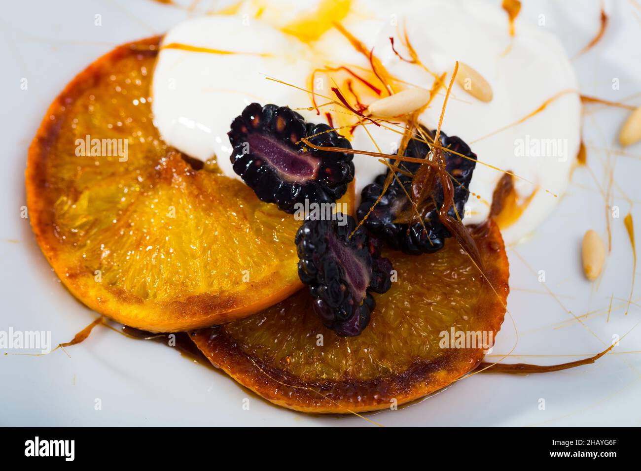 Caramel orange slices with berries and yogurt Stock Photo - Alamy