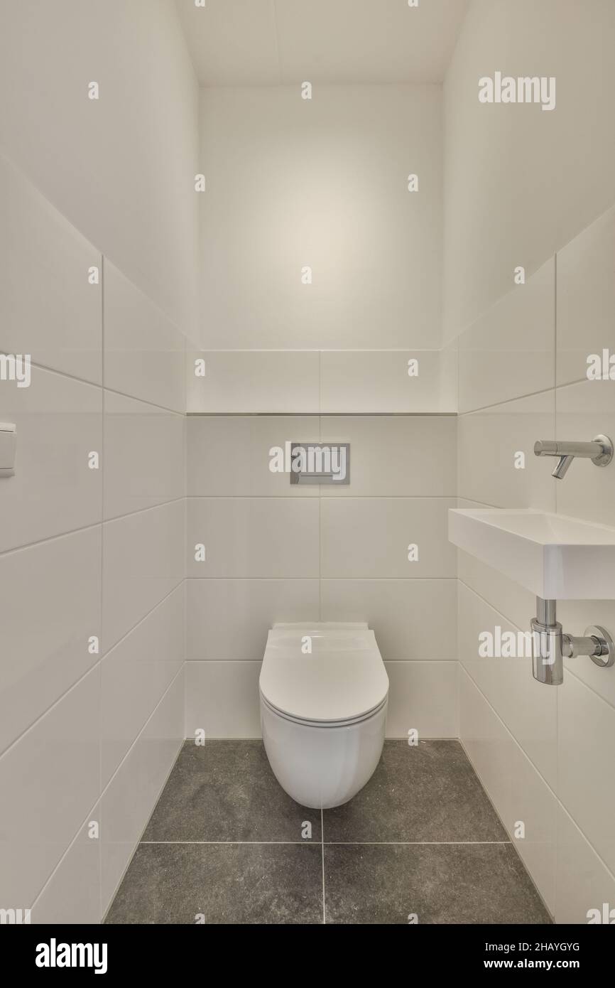 Interior of small clean restroom in miniature style Stock Photo - Alamy