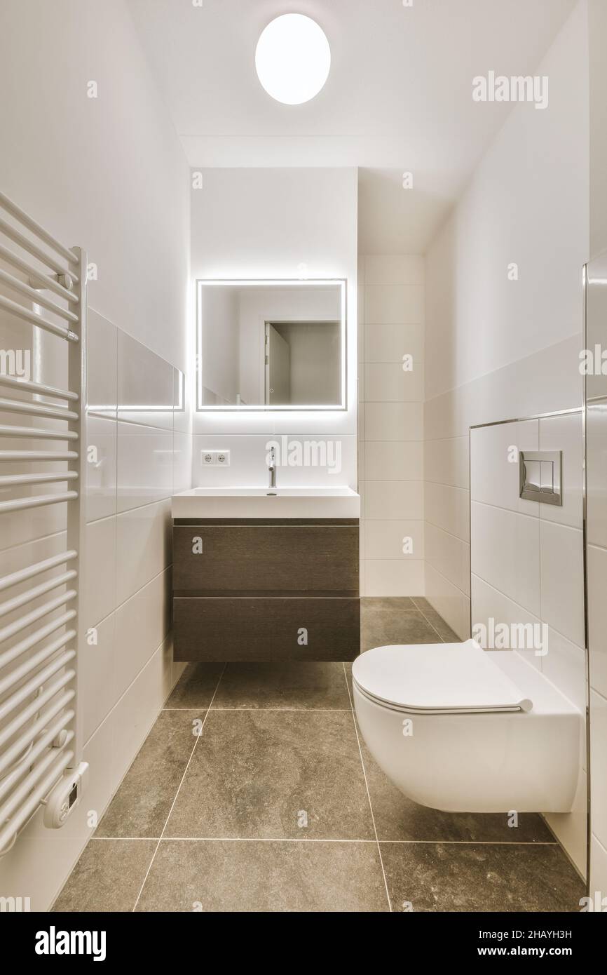 Interior of small clean restroom in miniature style Stock Photo - Alamy