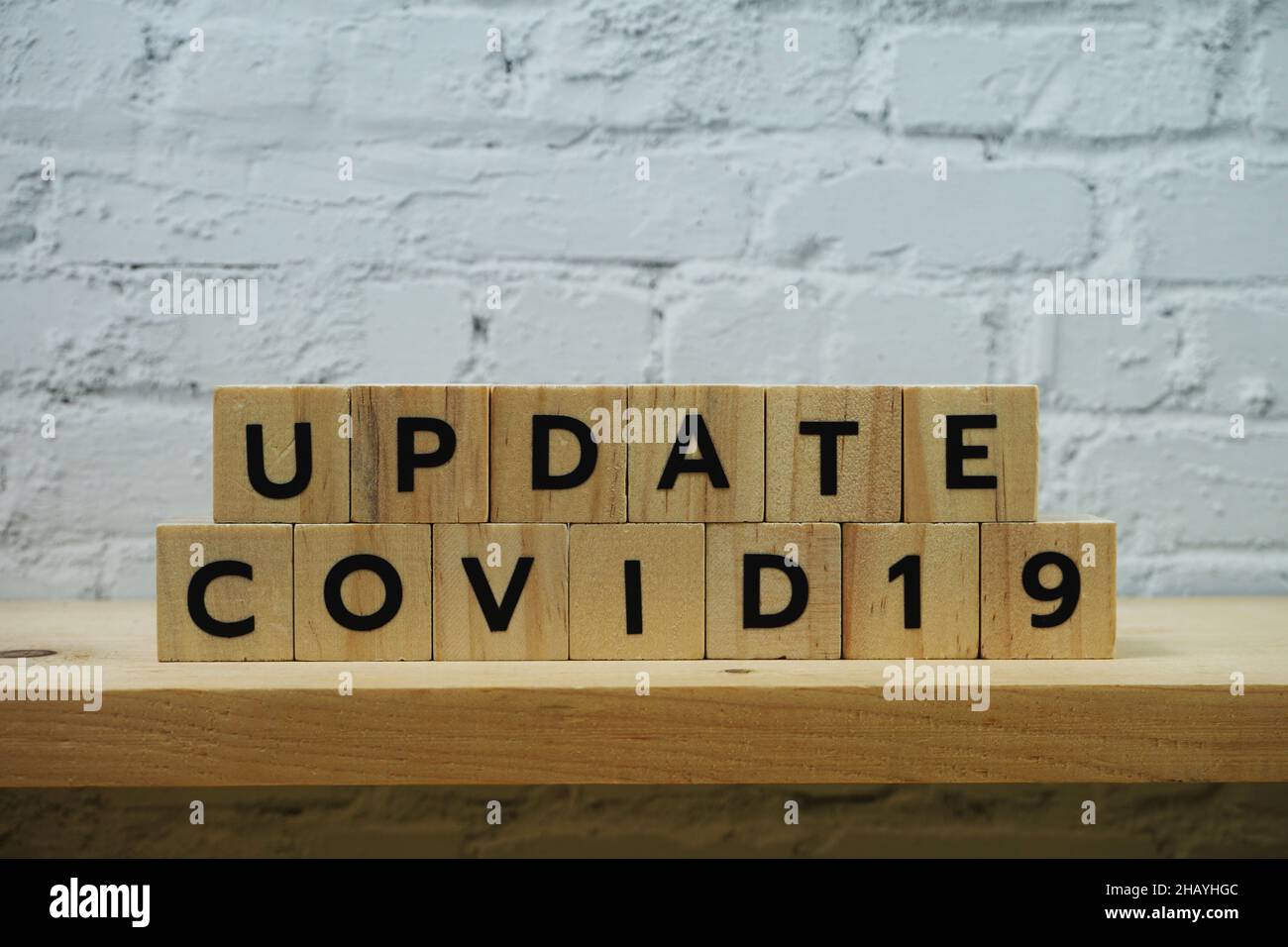 Update Covid-19 alphabet letter on white brick wall background Stock ...