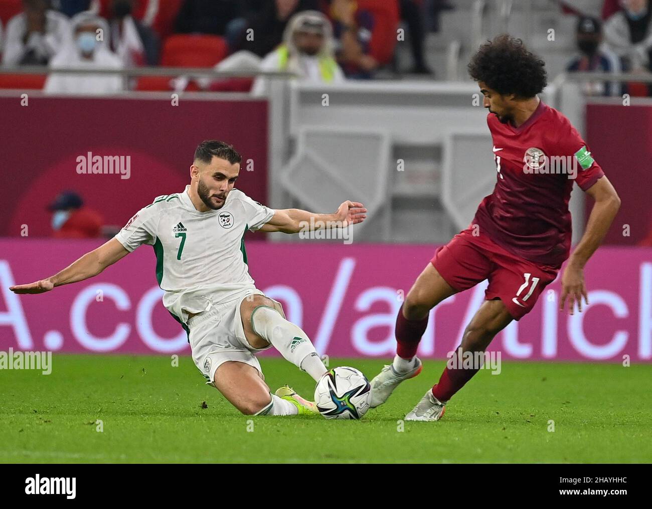 Doha, Qatar. 15th Dec, 2021. Meziani Tayeb (L) of Algeria vies with ...