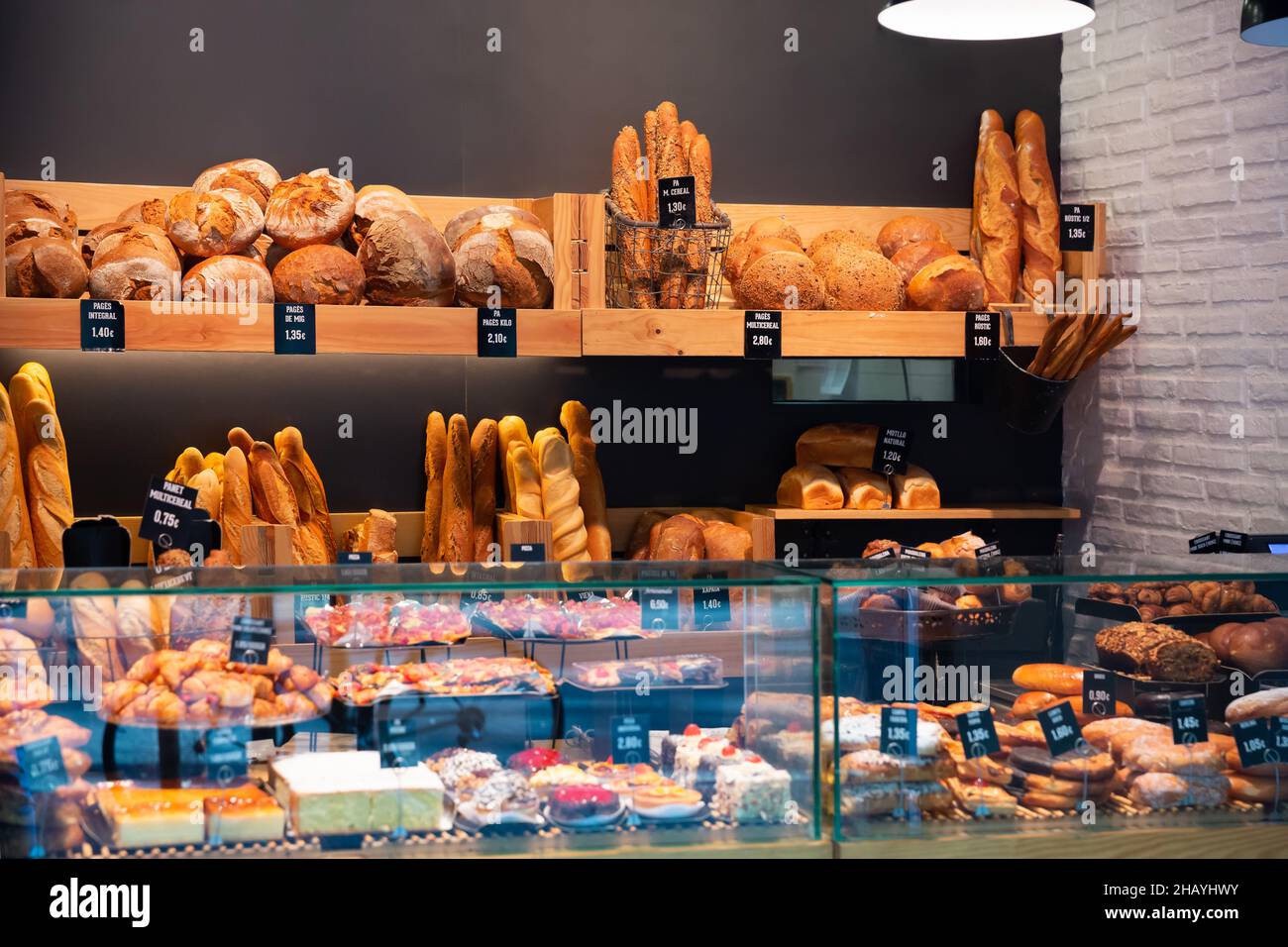 Bakery shop with assortment of bread on shelves Stock Photo - Alamy