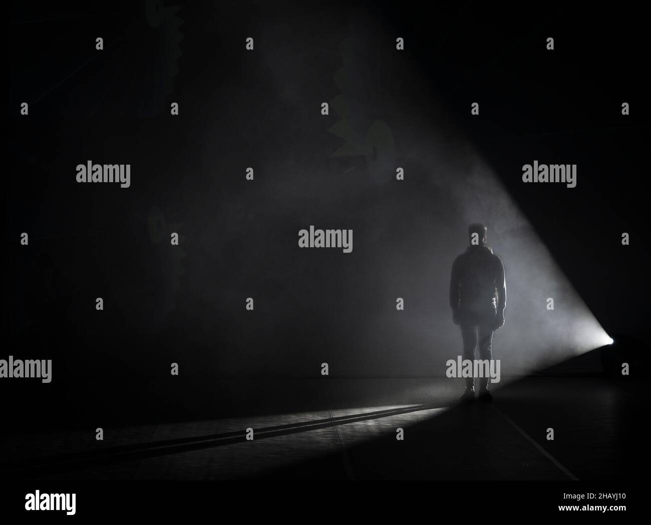 Silhouette of a spooky man standing in shadows Stock Photo - Alamy
