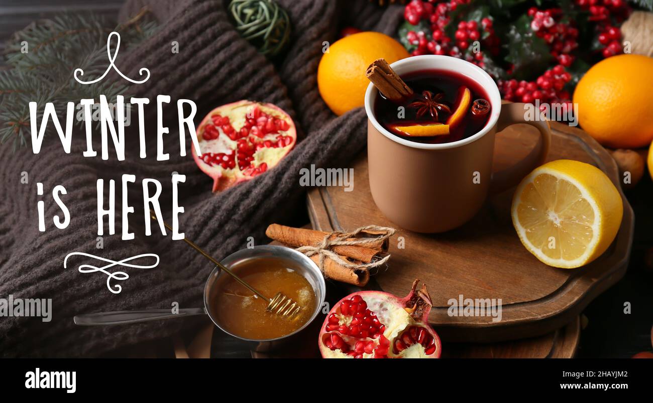 Cup of tasty mulled wine on table. Hello winter Stock Photo - Alamy