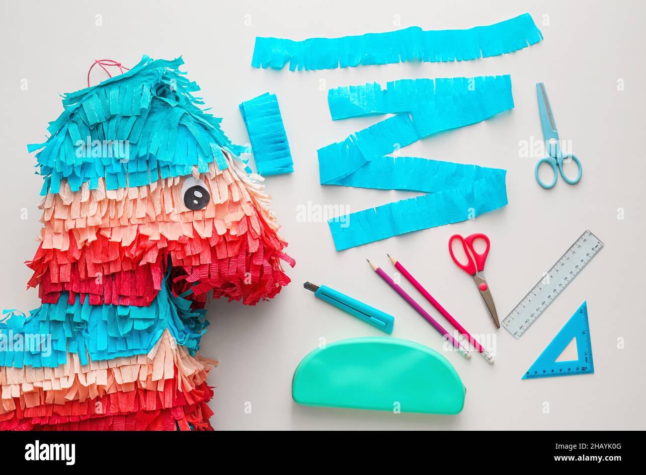 Materials for making Mexican pinata in shape of horse on white ...