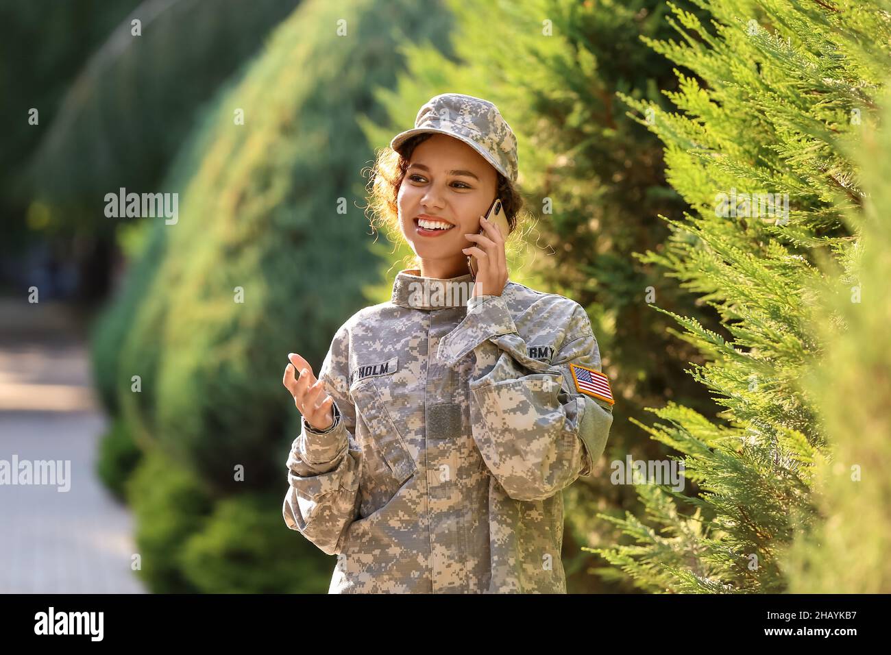 African-American female soldier talking by phone outdoors Stock Photo ...