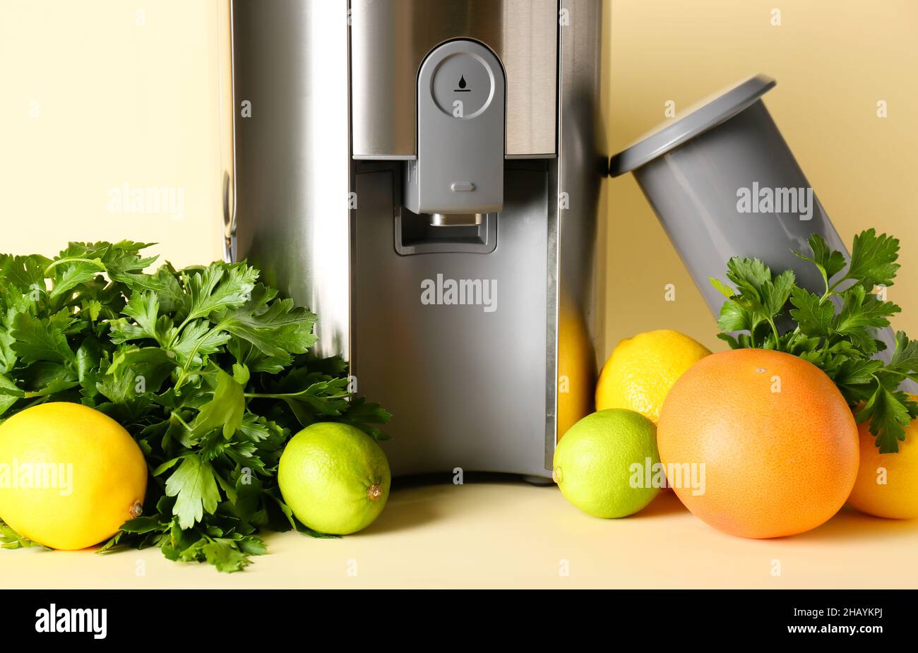 Modern juicer with fresh fruits on color background Stock Photo - Alamy