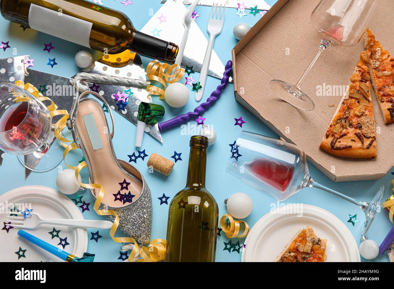 Composition of after party mess on color background. Christmas ...