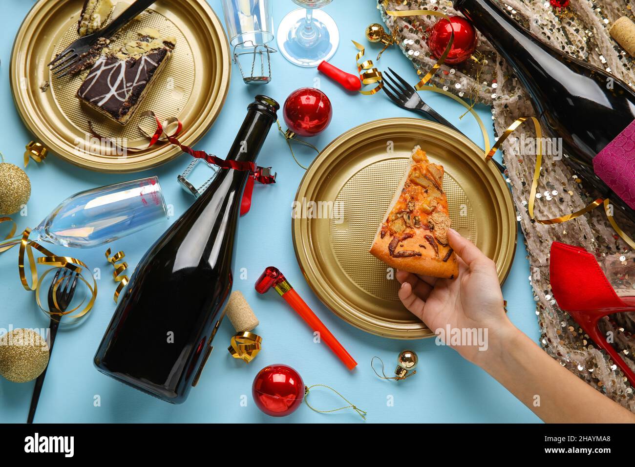 Composition of after party mess on color background. Christmas ...