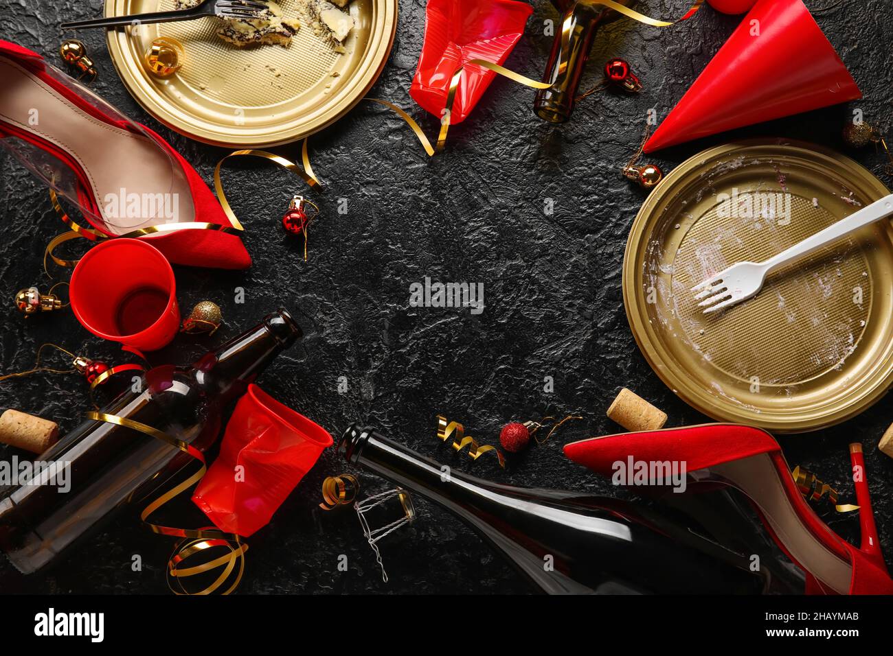 Composition of after party mess on dark background. Christmas ...