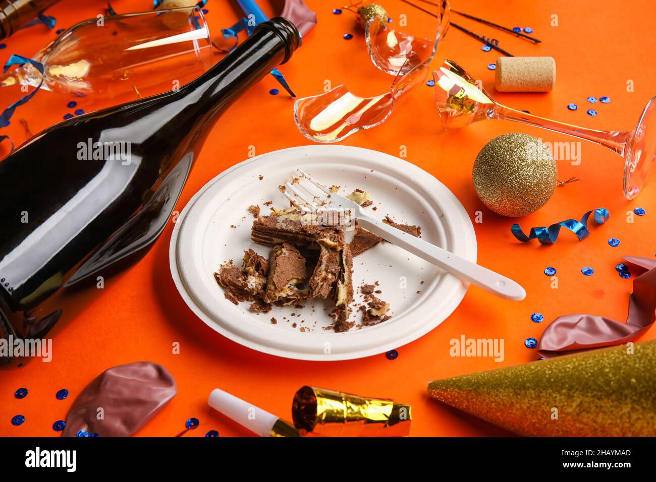 Composition of after party mess on color background. Christmas ...