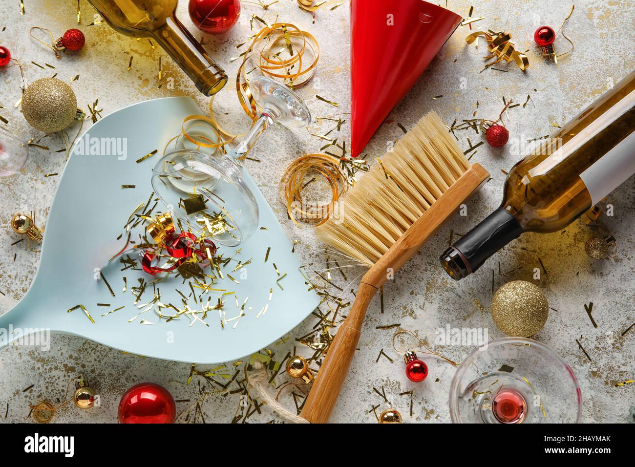 Cleaning of after party mess on grunge background. Christmas ...