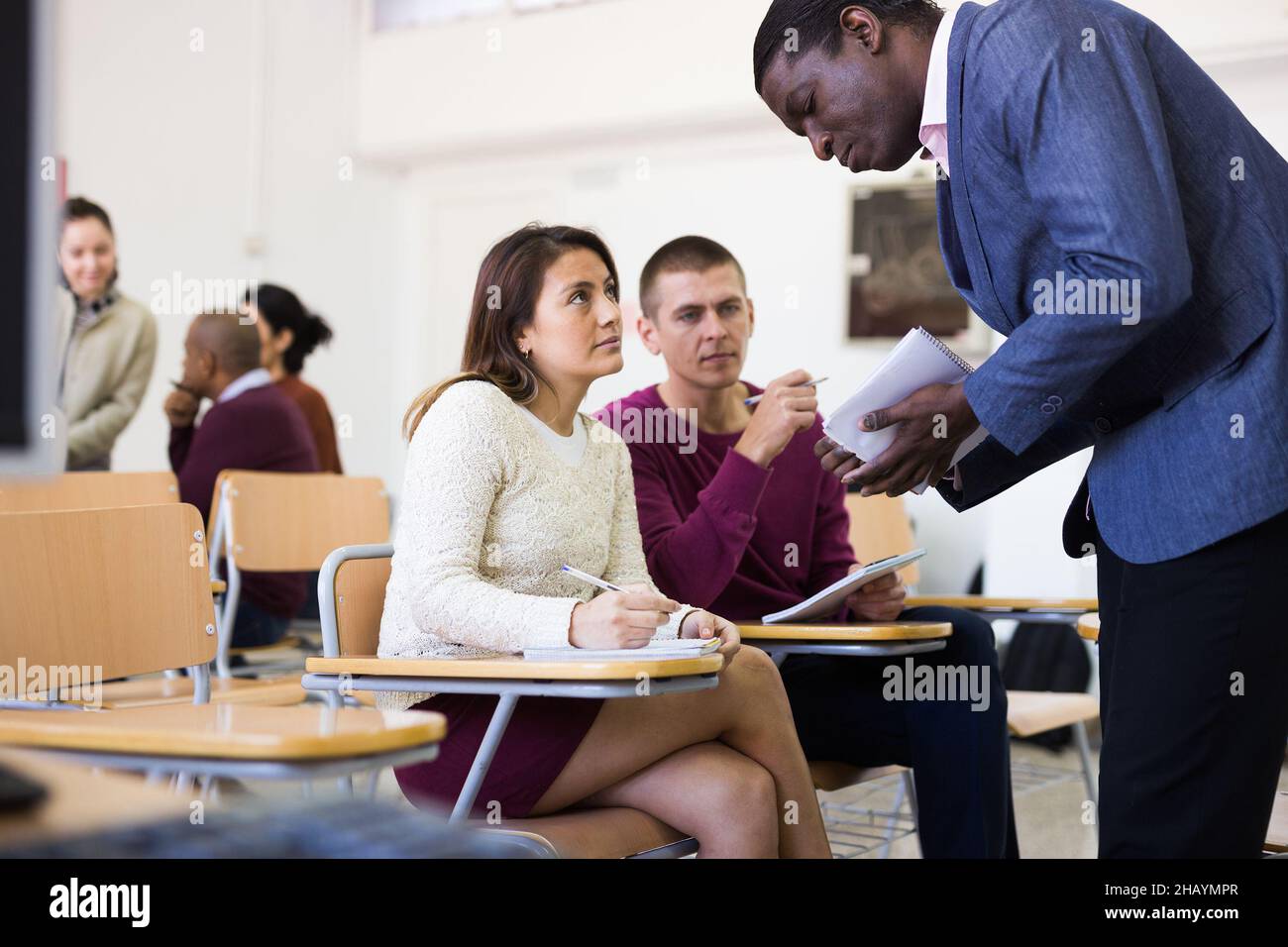 Students talking during class hi-res stock photography and images - Alamy