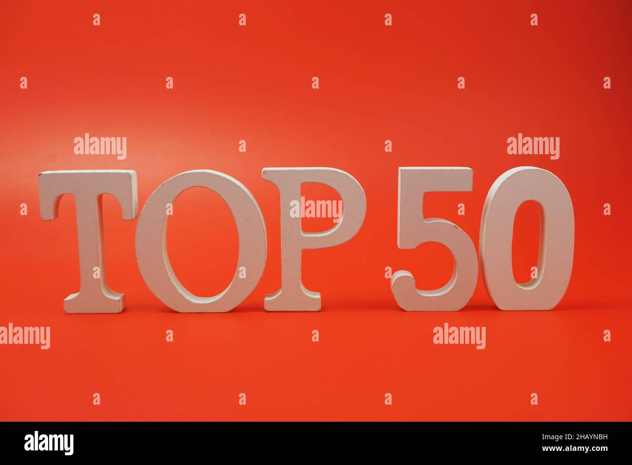 Top 50 word alphabet letters on red background Stock Photo - Alamy