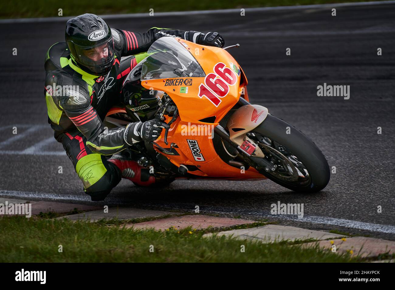 12-12-2021 Riga, Latvia Motorcycle practice leaning into a fast corner ...