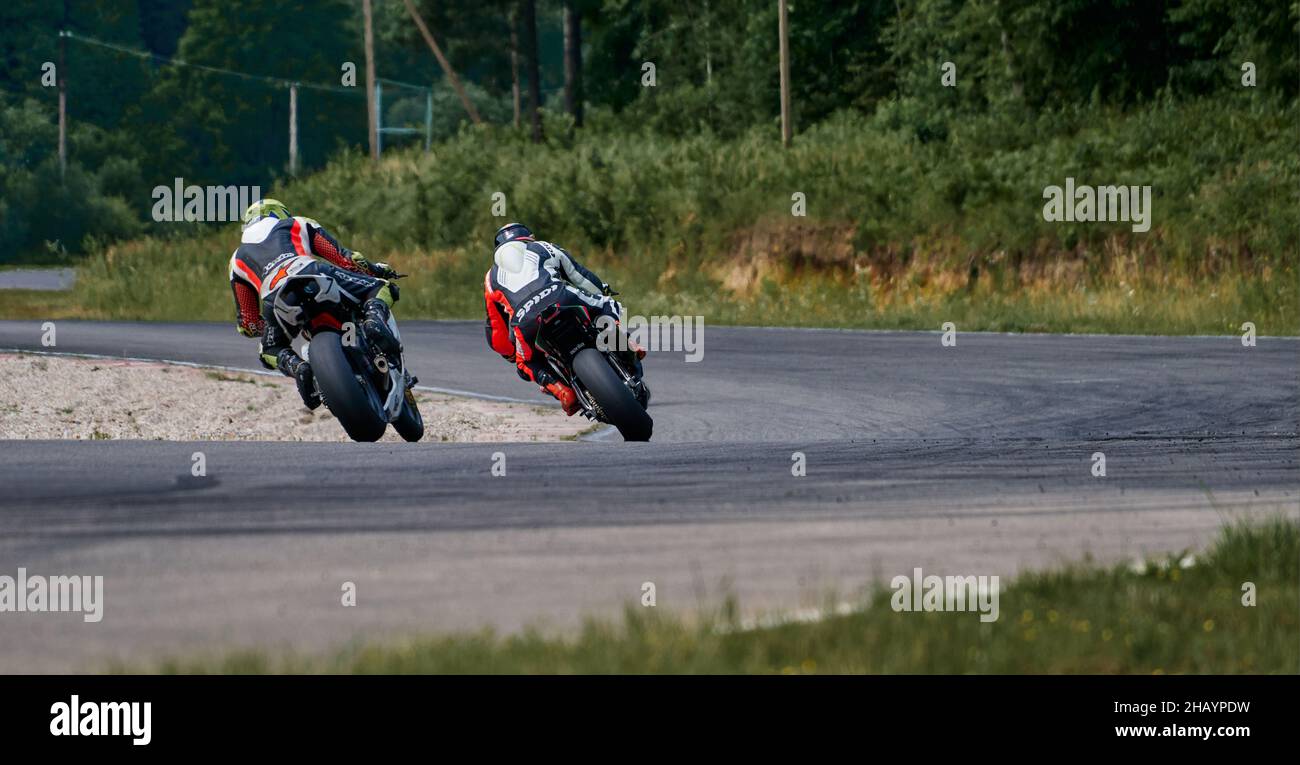 12-12-2021 Riga, Latvia Motorcycle practice leaning into a fast corner ...
