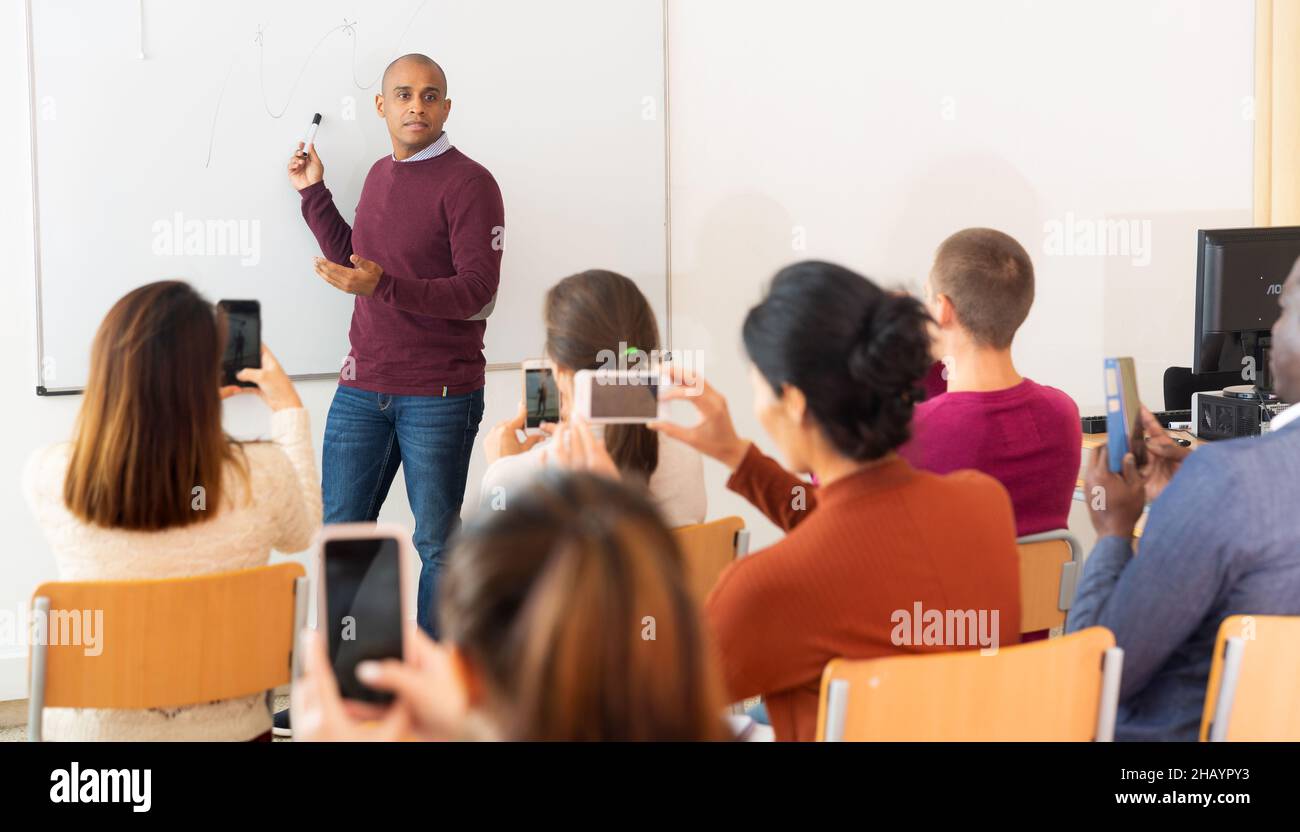Teacher conducts refresher course for employees Stock Photo - Alamy