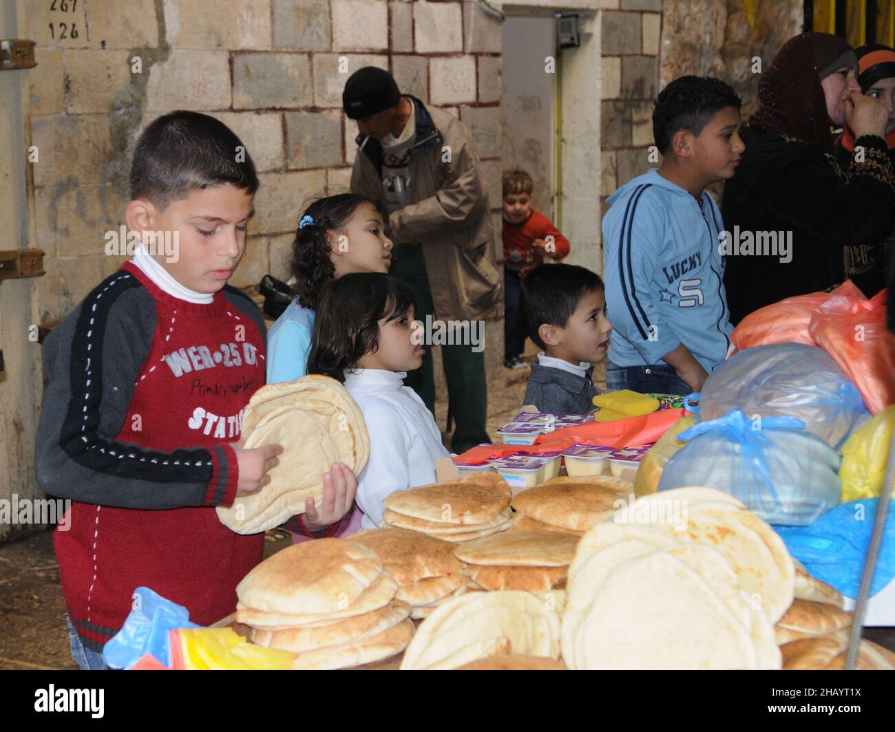 A Palestinian boy selling pita bread in the old city of Jerusalem Stock ...