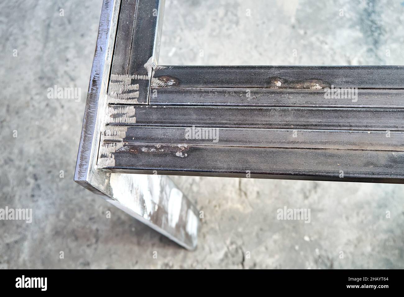 Metal table base welded from metal sheets and rectangular pipes in the ...