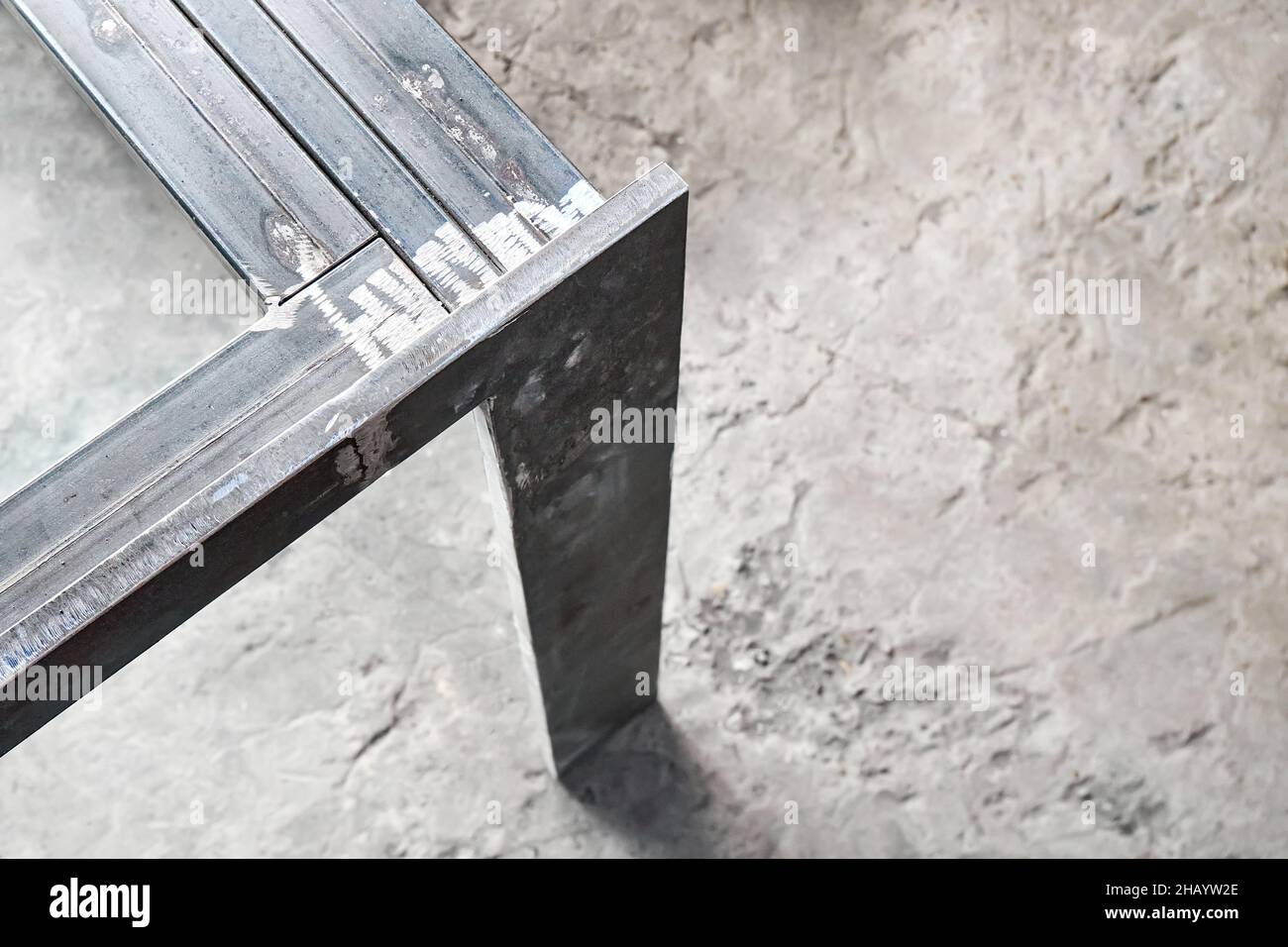 Metal table base welded from metal sheets and rectangular pipes in the ...